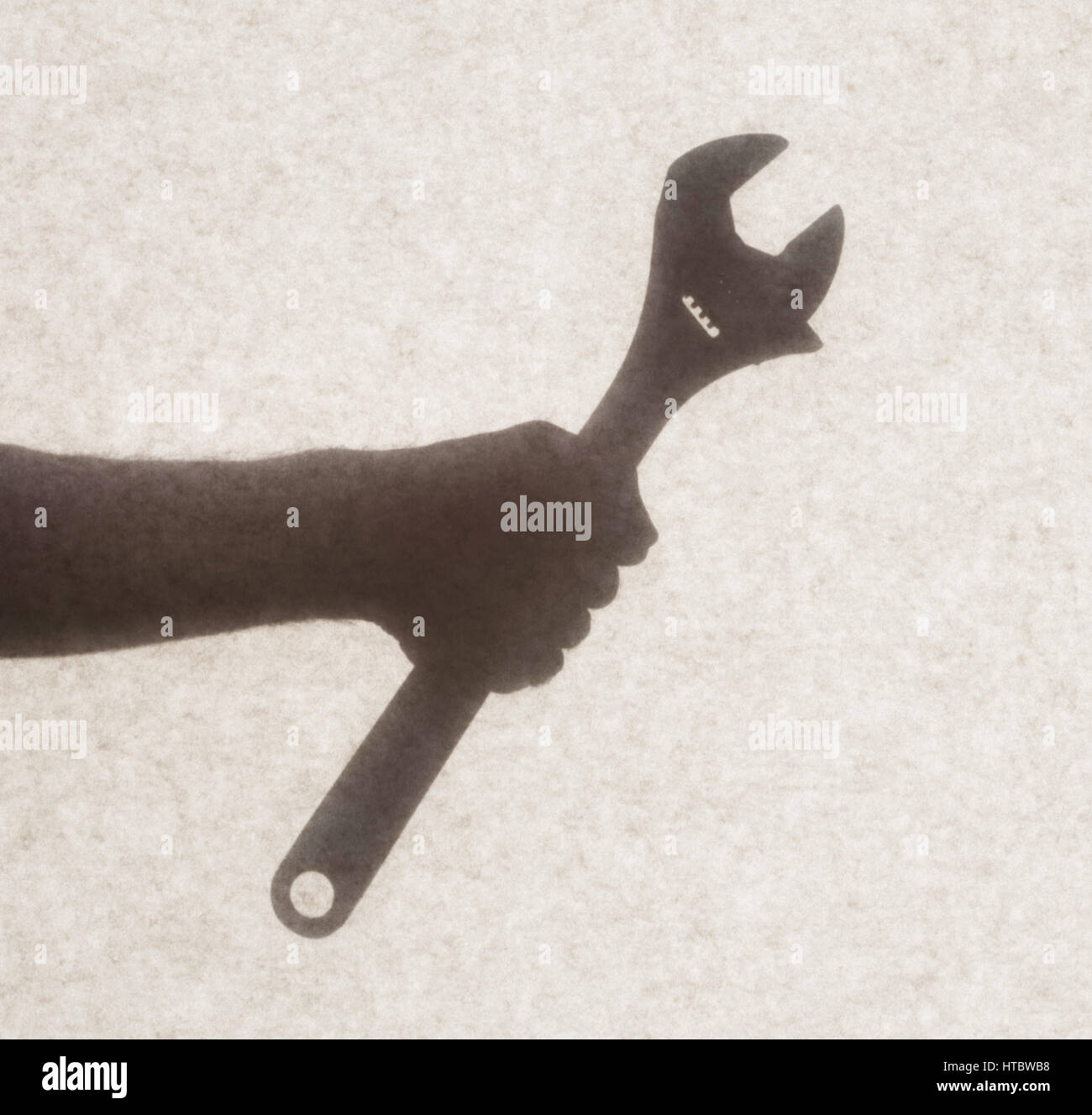 Silhouette behind a transparent paper - English wrench Stock Photo - Alamy