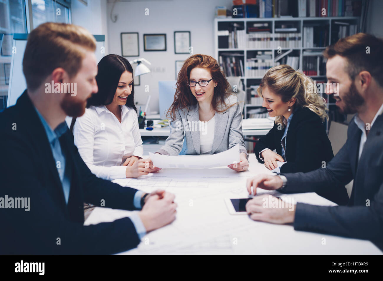 Business meeting and cooperation by business people in office Stock ...