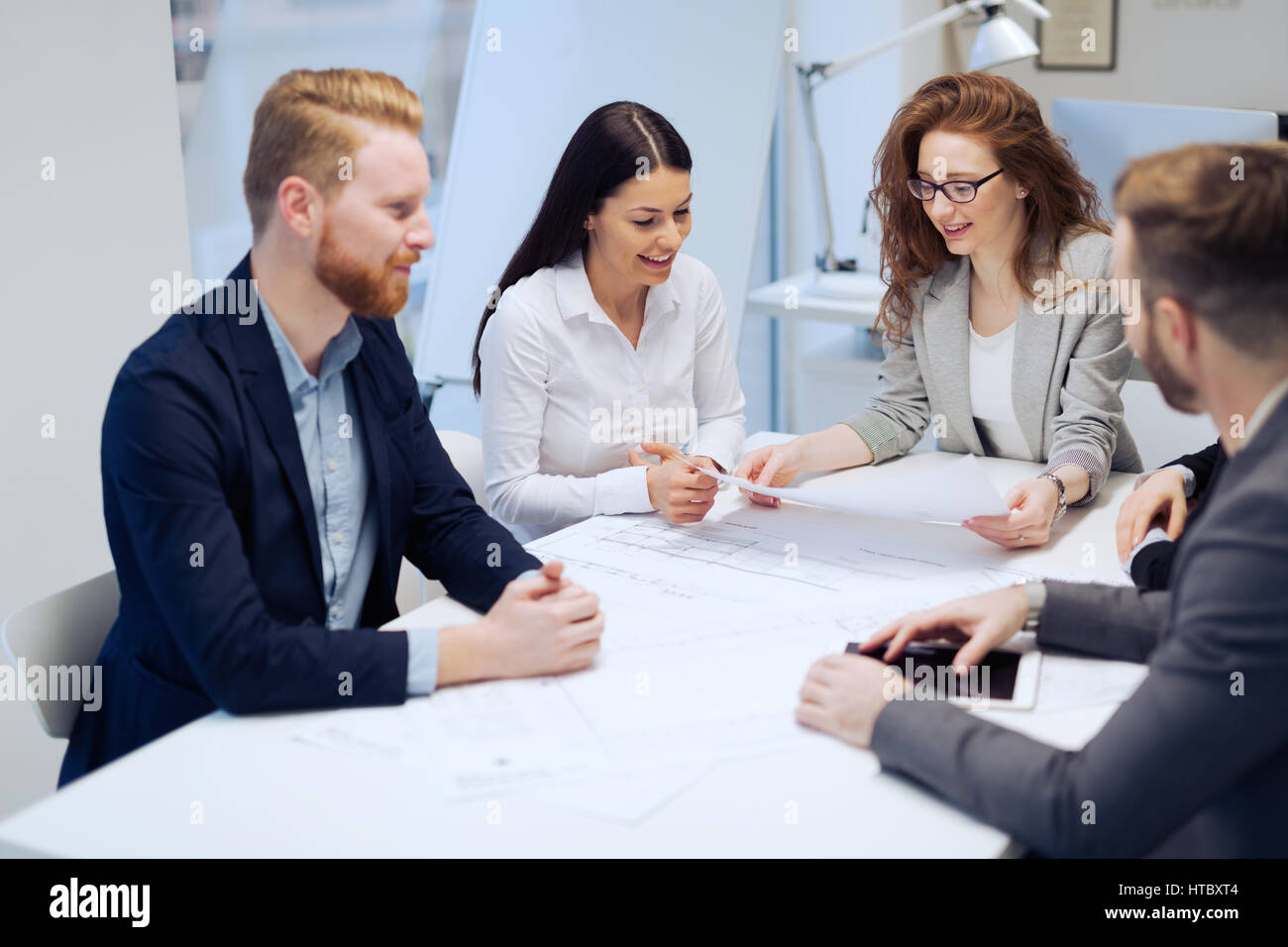 Business meeting and cooperation by business people in office Stock ...