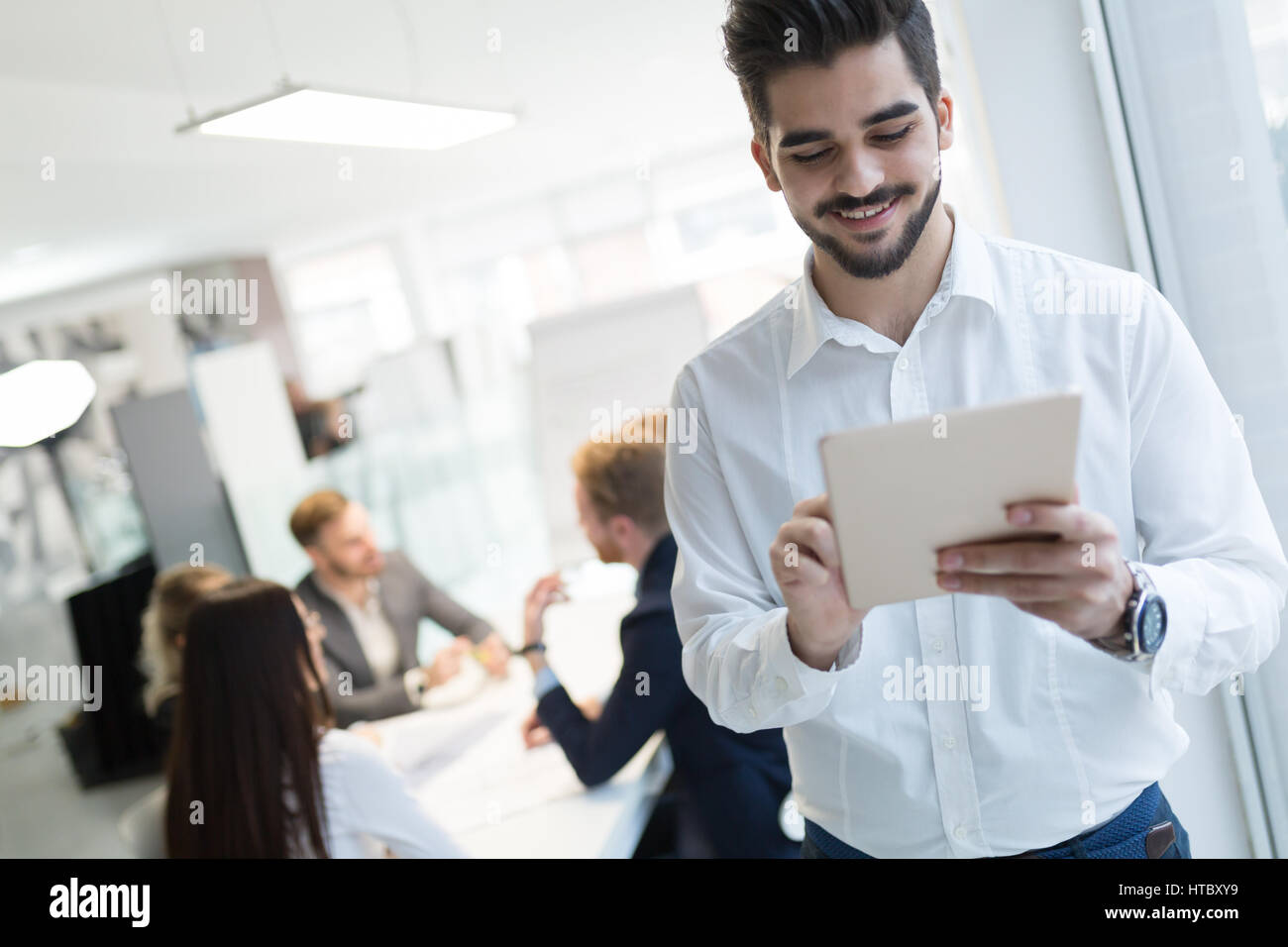 Successful happy worker in information technology industry working in ...