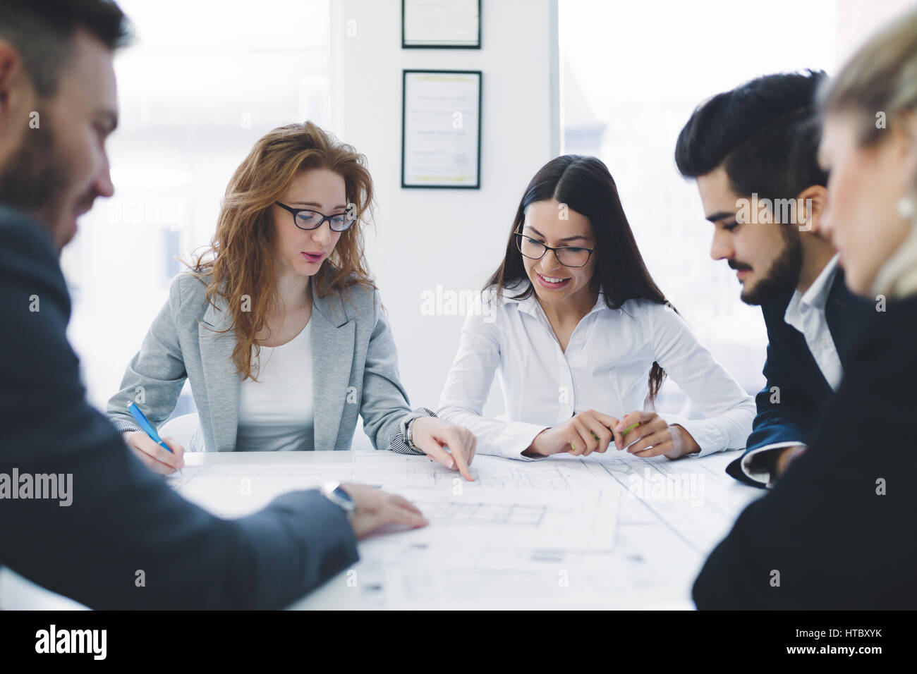 Business meeting and cooperation by business people in office Stock ...