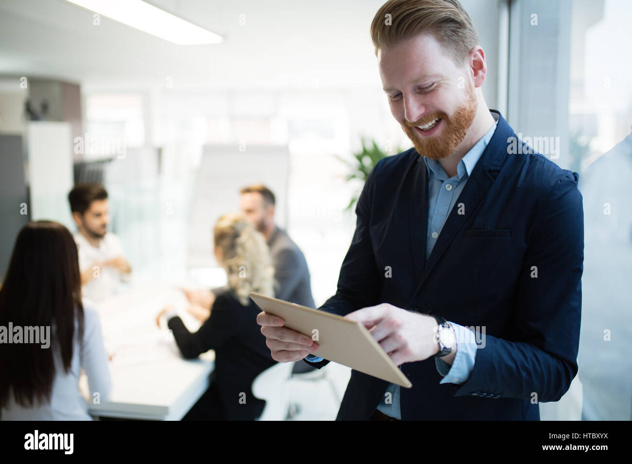 Handsome businessman ceo working in company office Stock Photo - Alamy