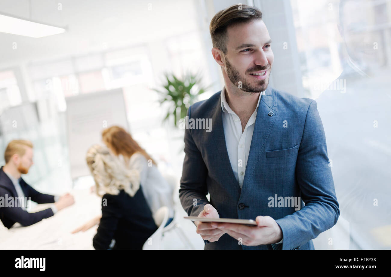 Handsome businessman ceo working in company office Stock Photo - Alamy
