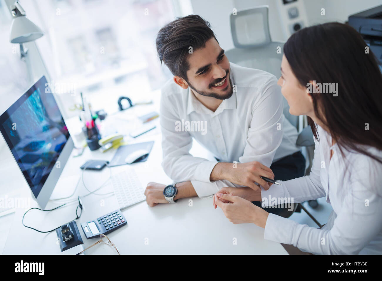 Happy collaborating business colleagues discussing future plans Stock ...