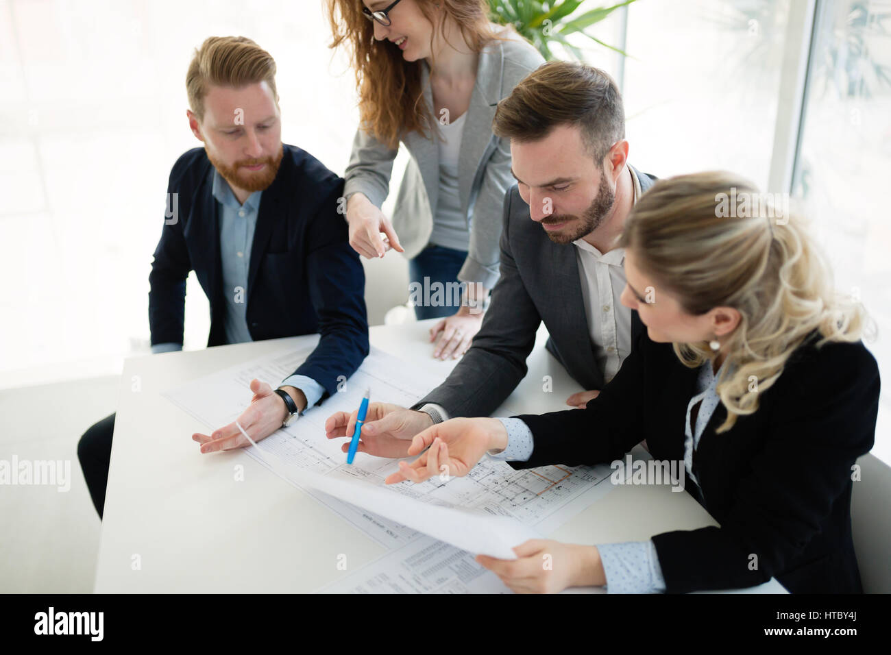 Business meeting and cooperation by business people in office Stock ...