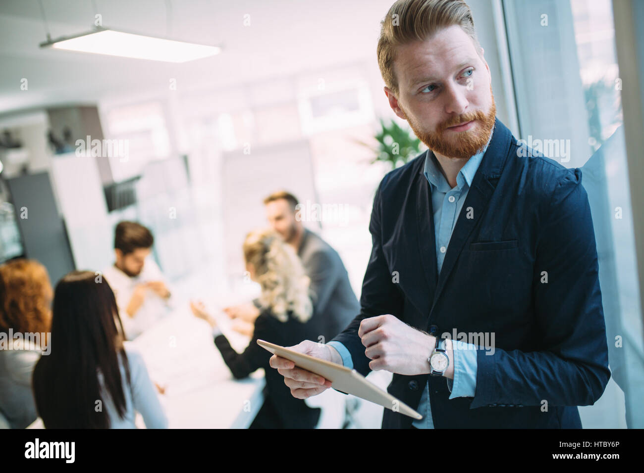 Handsome businessman ceo working in company office Stock Photo - Alamy