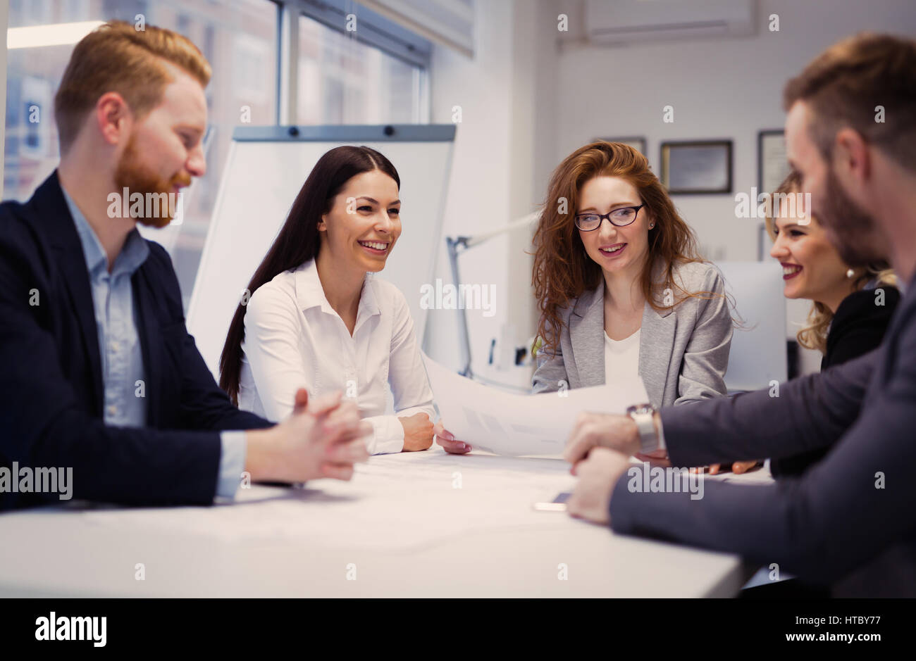 Business meeting and cooperation by business people in office Stock ...