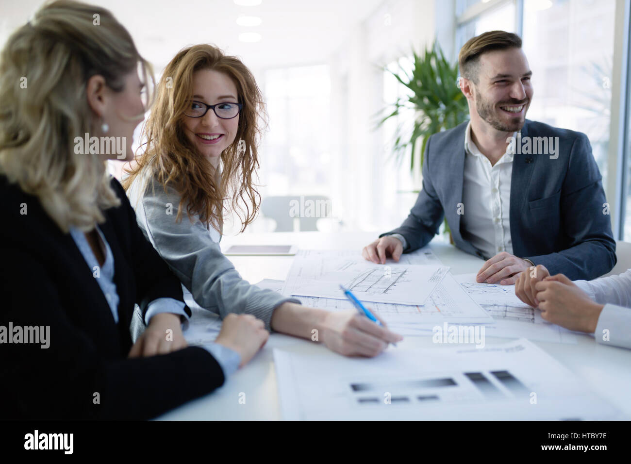 Business meeting and cooperation by business people in office Stock ...
