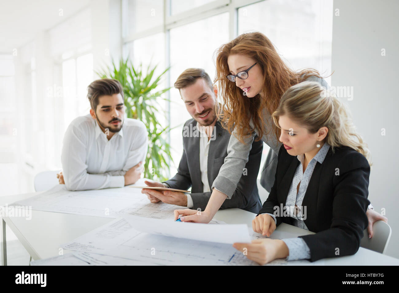 Business meeting and cooperation by business people in office Stock ...