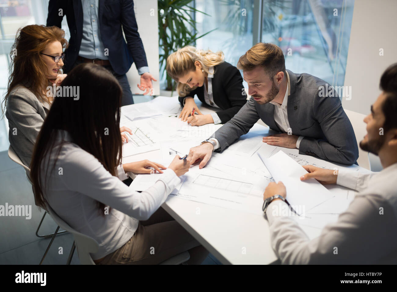 Business meeting and cooperation by business people in office Stock ...