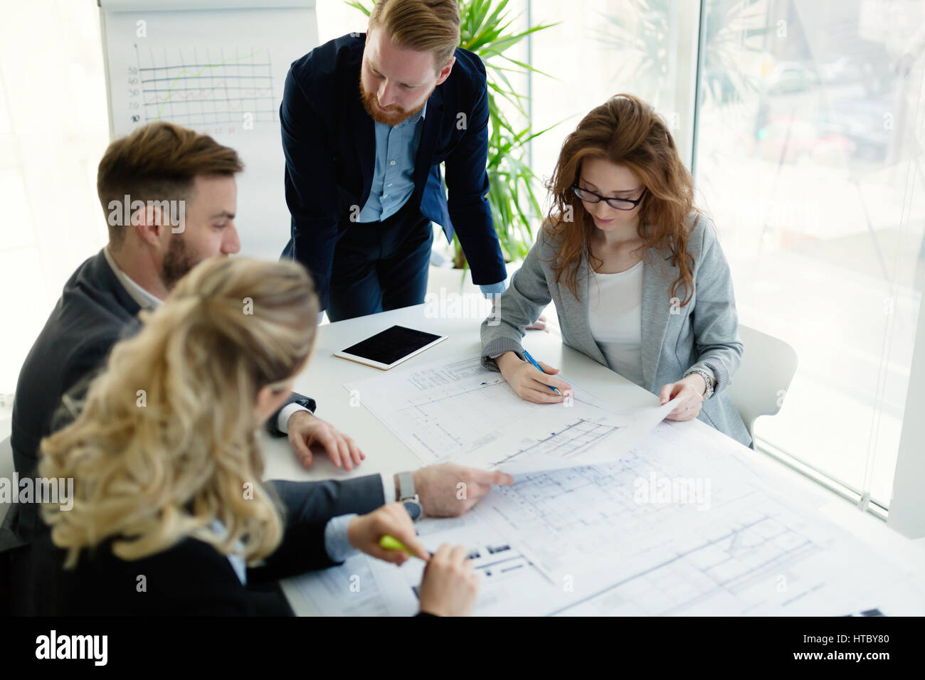 Business meeting and cooperation by business people in office Stock ...