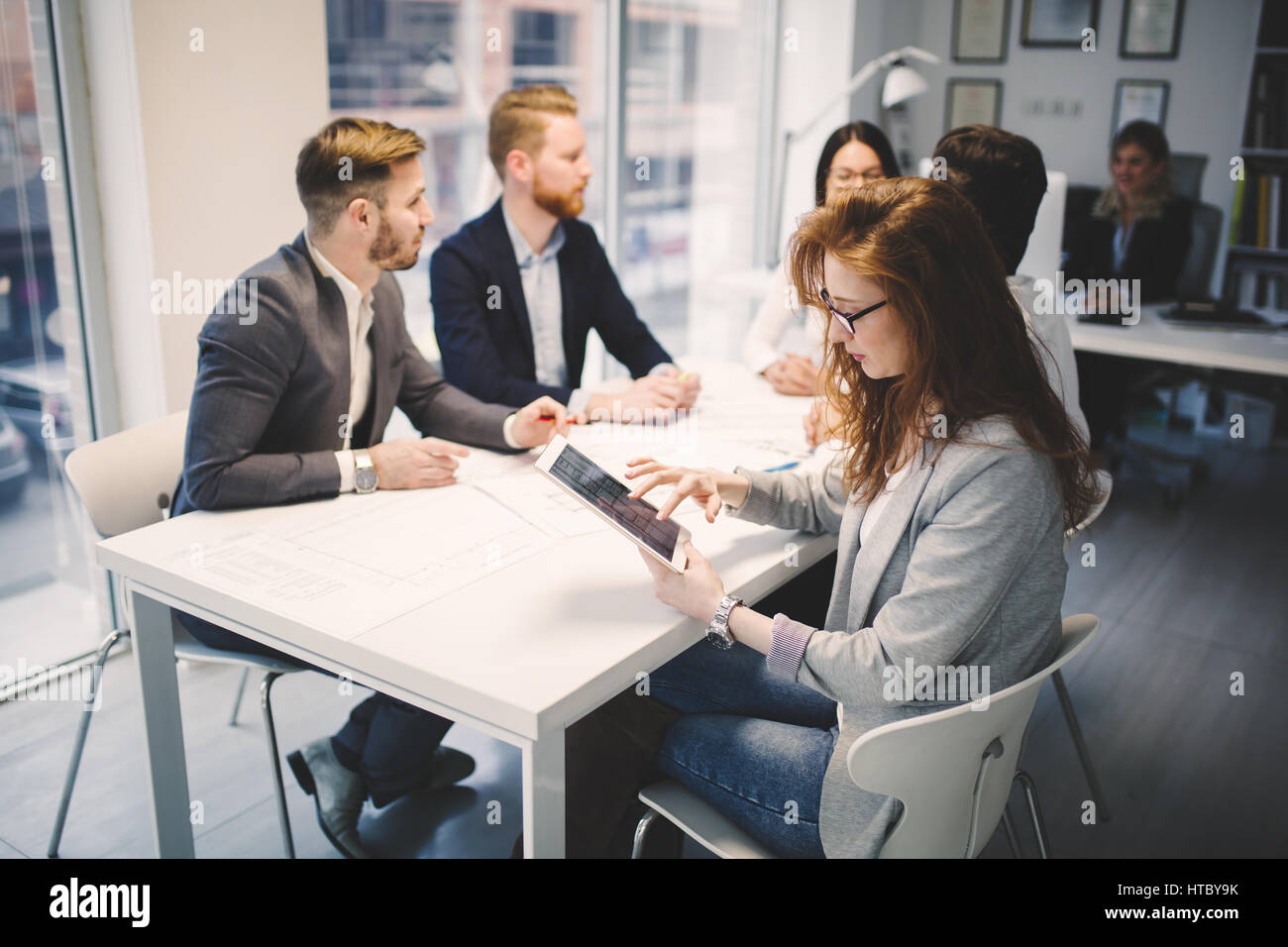 Business meeting and cooperation by business people in office Stock ...