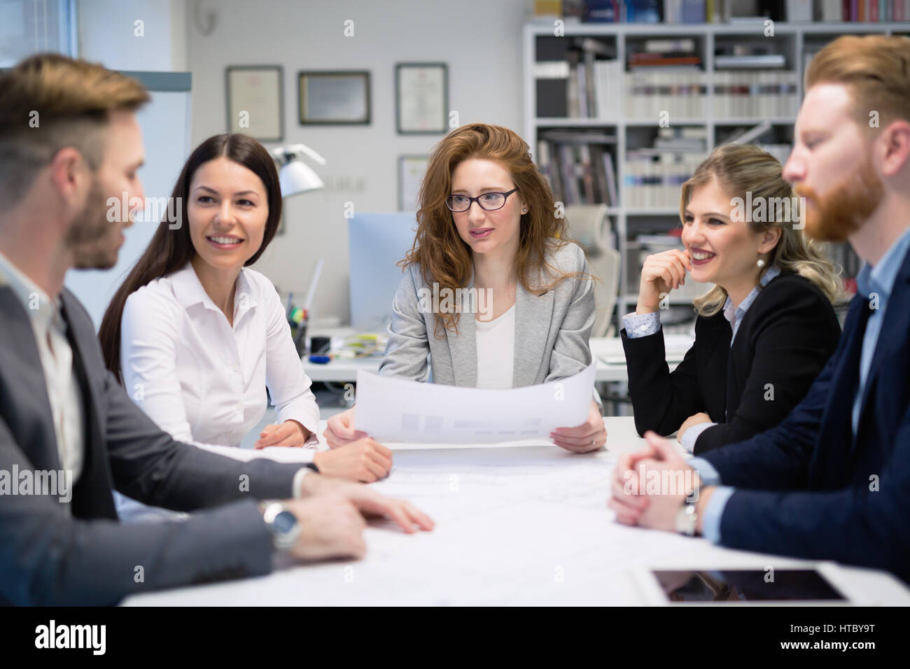 Business meeting and cooperation by business people in office Stock ...