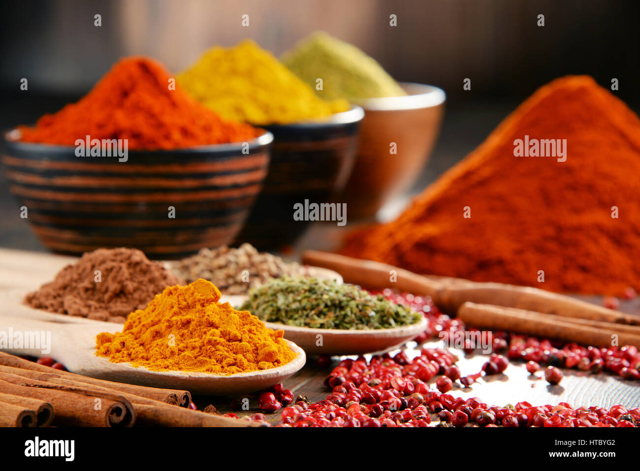 Variety of spices on kitchen table Stock Photo - Alamy