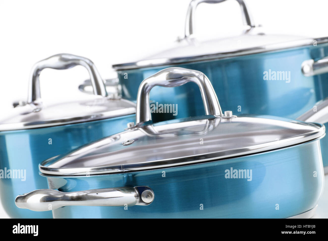 Composition with three steel pots Stock Photo - Alamy