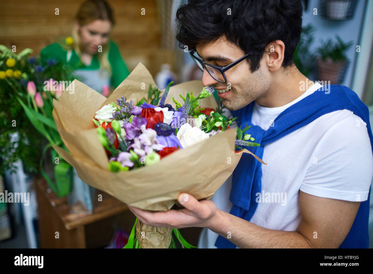 Man smelling flower hi-res stock photography and images - Alamy