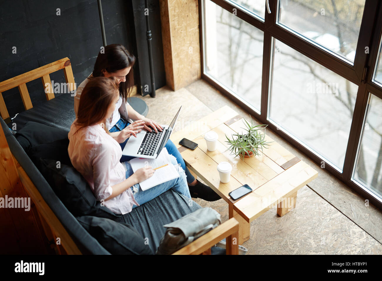 Two students discussing their ideas upon college project Stock Photo ...