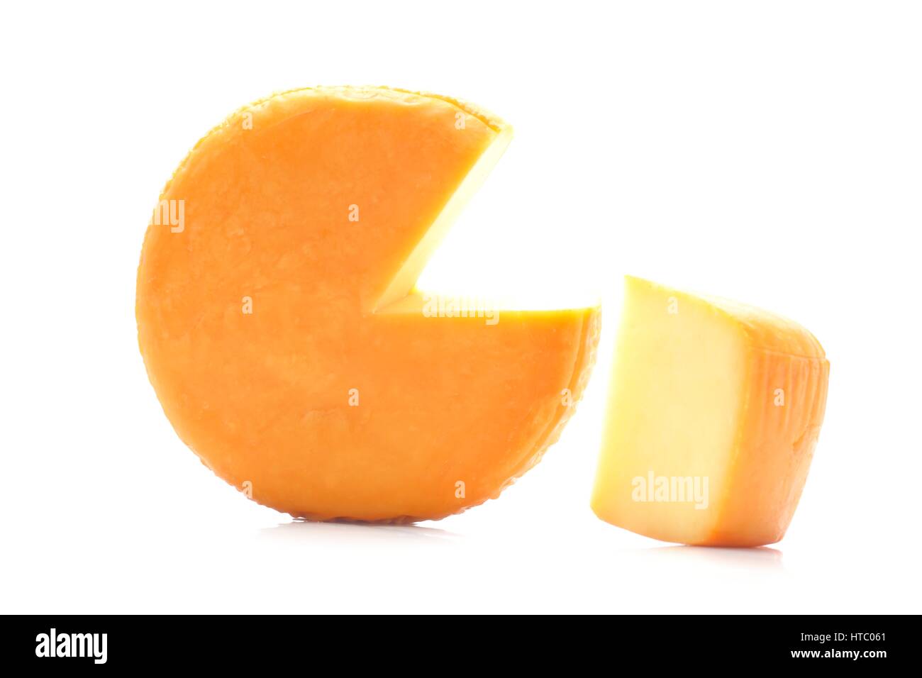 cheese wheel with clice isolated on white background Stock Photo - Alamy