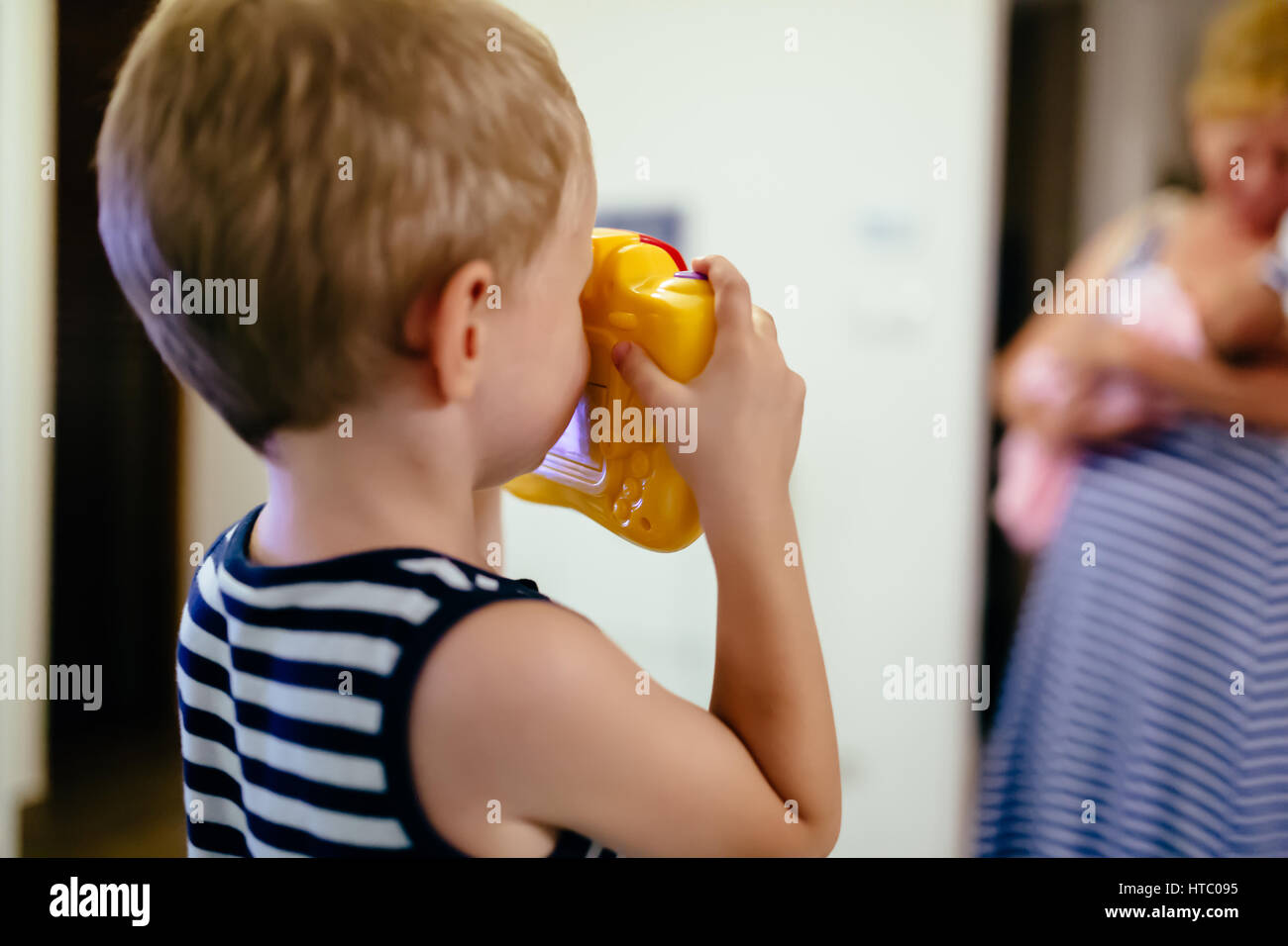 Cute boy wants to become photographer Stock Photo - Alamy