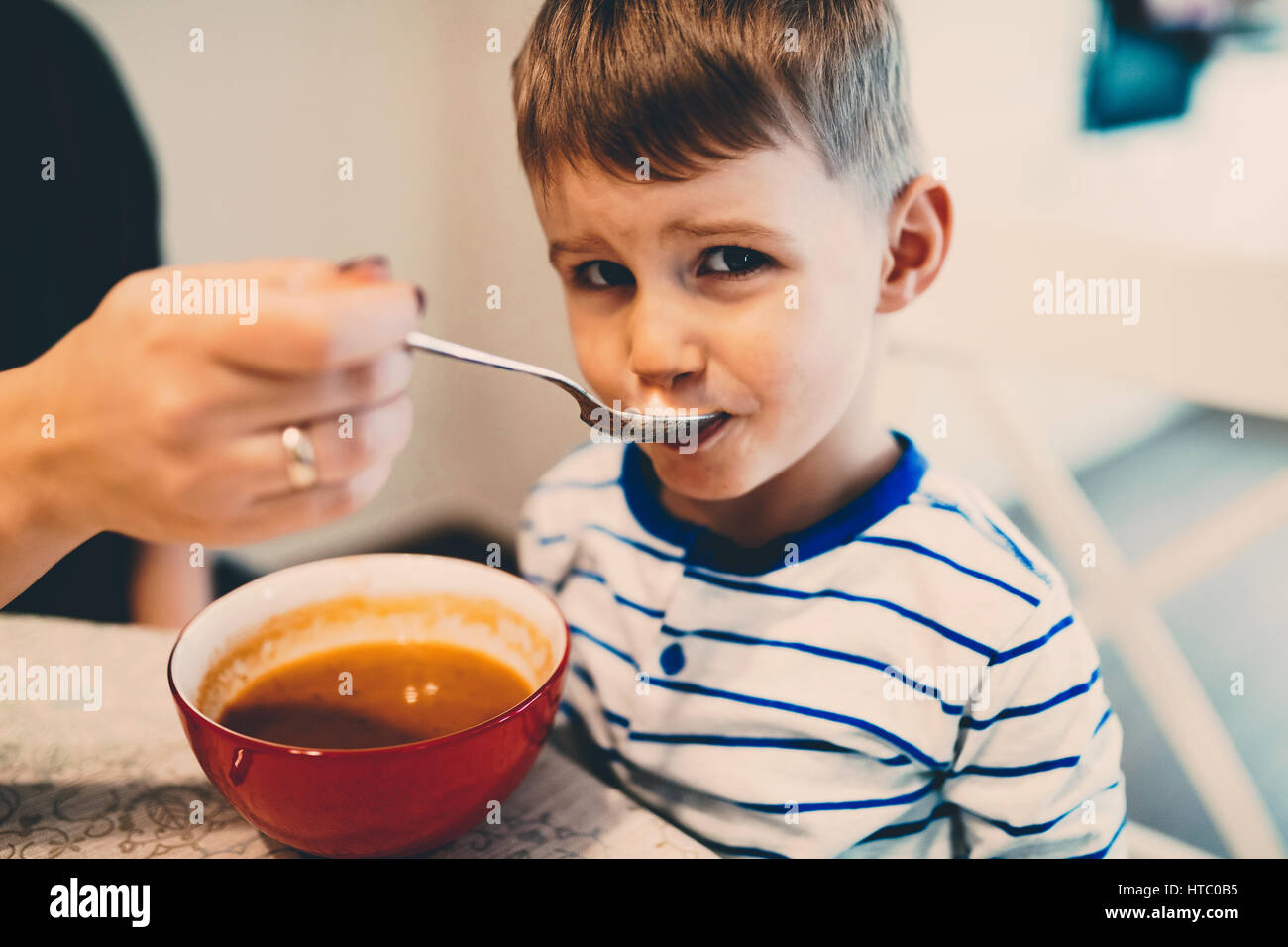 Children have to learn to eat independantly alone Stock Photo - Alamy