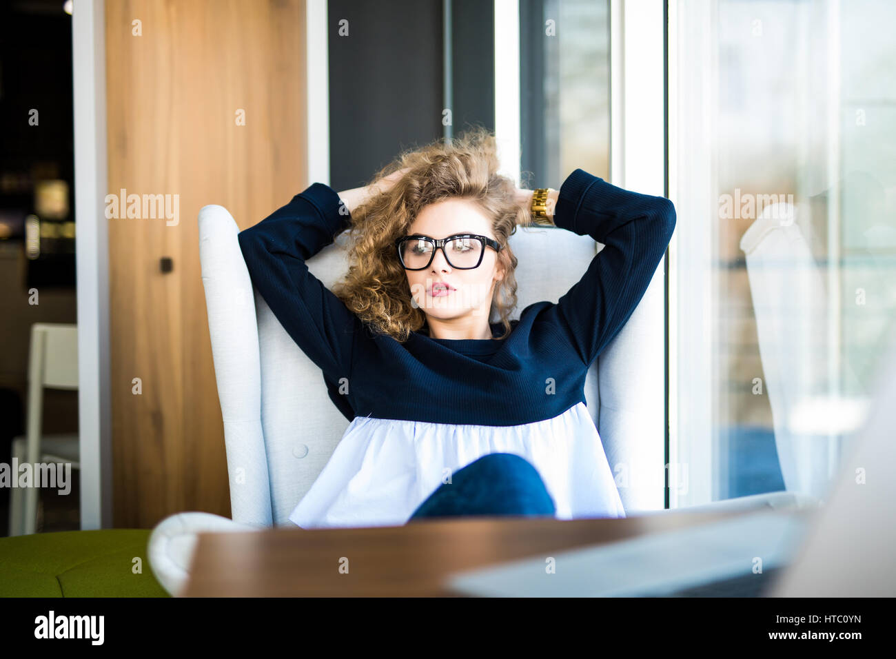 Business woman relaxing working at office desk laid back resting on ...