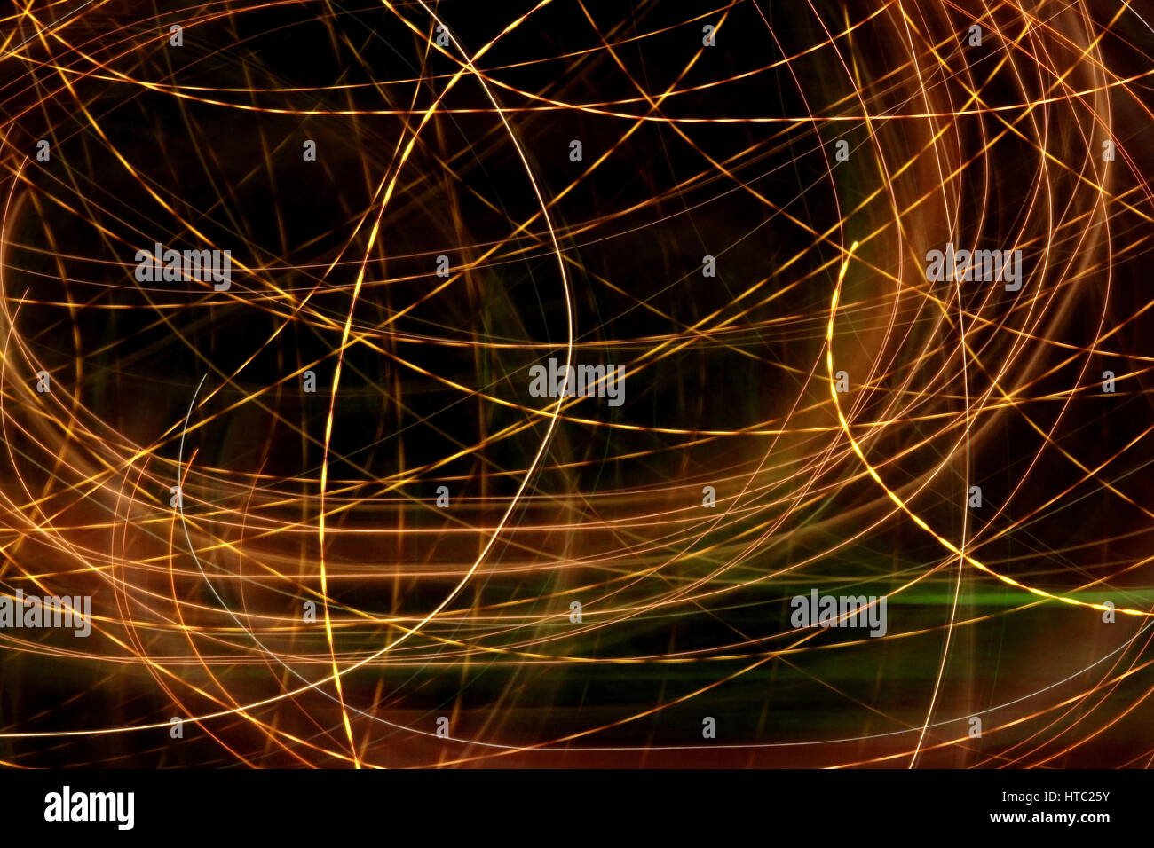 Abstract light trails yellow and blue hi-res stock photography and ...