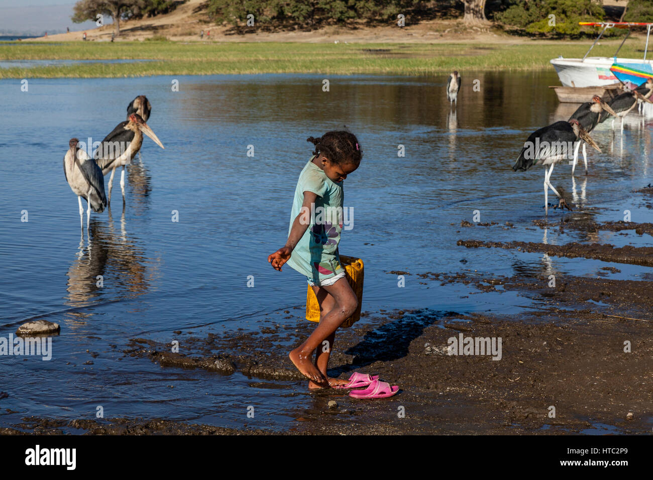People fetching water hi-res stock photography and images - Alamy