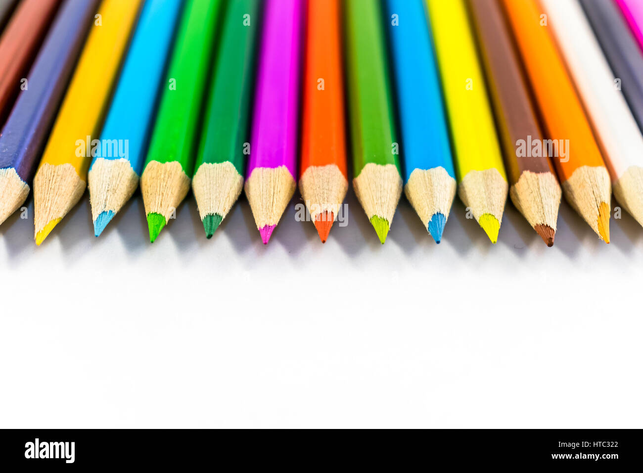 School supplies colored pencils in a row Stock Photo - Alamy