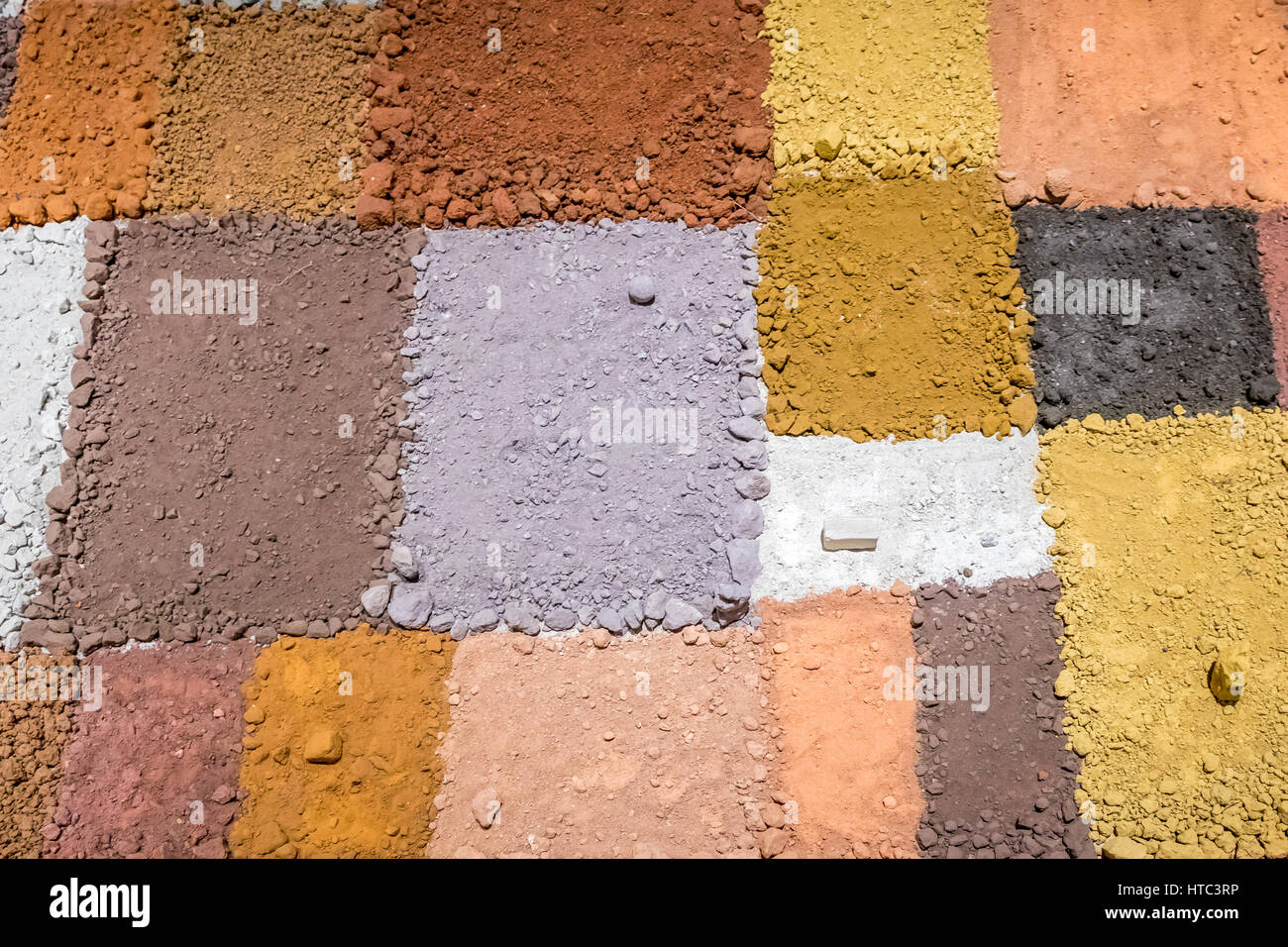 Texture of different colors of dry clay with stones Stock Photo - Alamy
