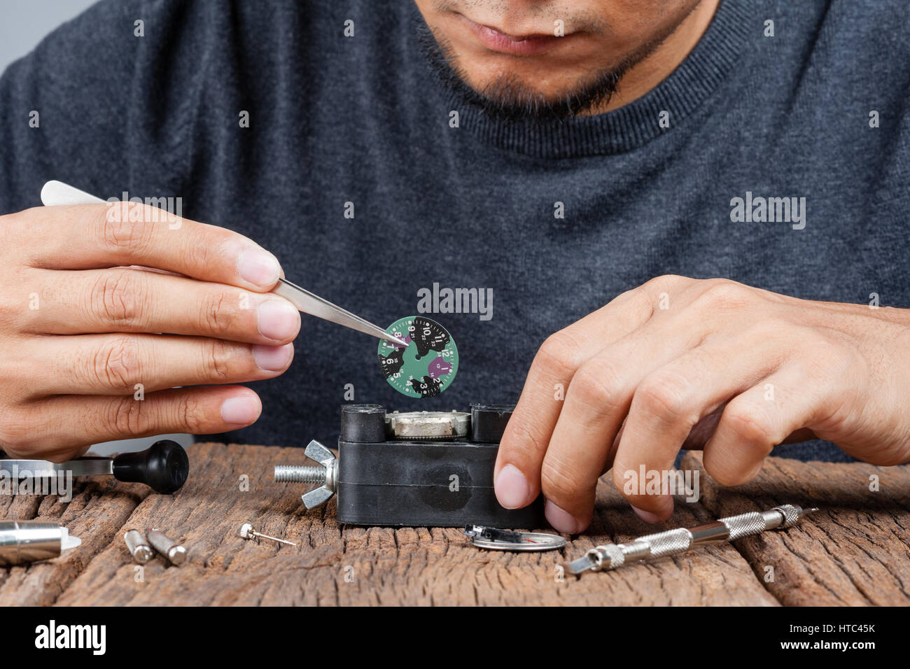 The man repairing the old watch, closeup his hand Stock Photo - Alamy