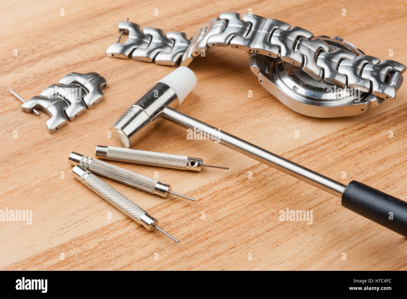 adjusting the watch bracelet with pin punch, tool for watch Stock Photo ...