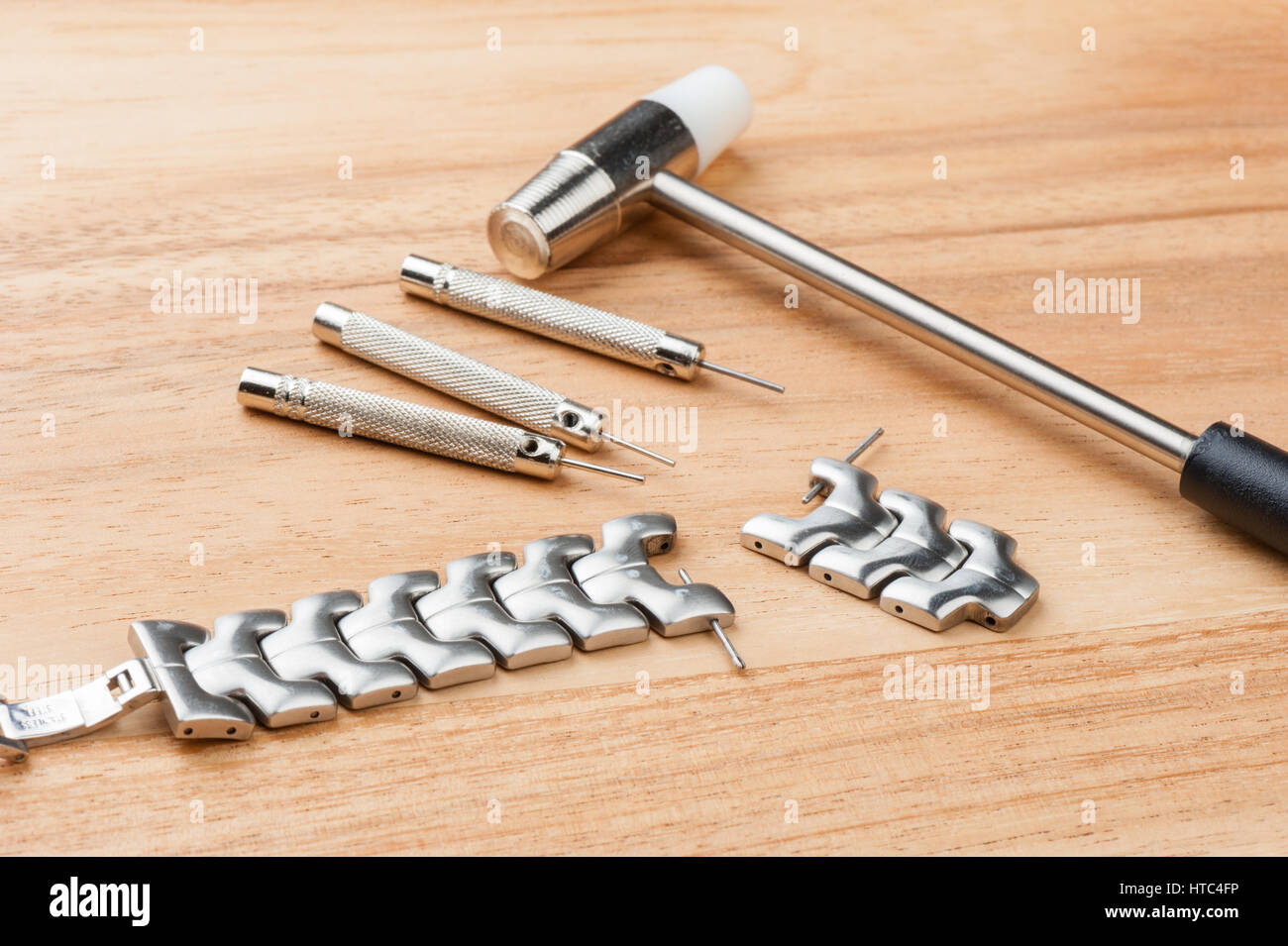 adjusting the watch bracelet with pin punch, tool for watch Stock Photo ...