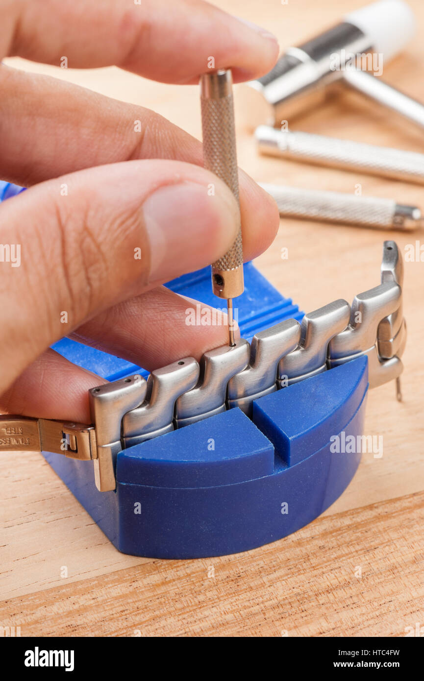 adjusting the watch bracelet with pin punch, tool for watch Stock Photo ...