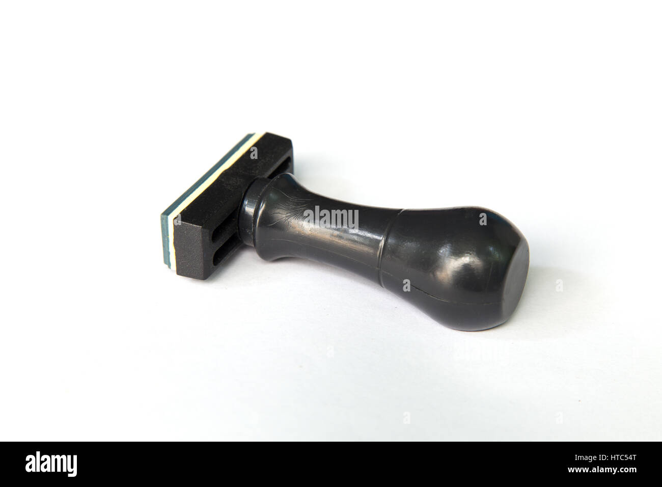 Rubber stamper isolated on white background Stock Photo - Alamy