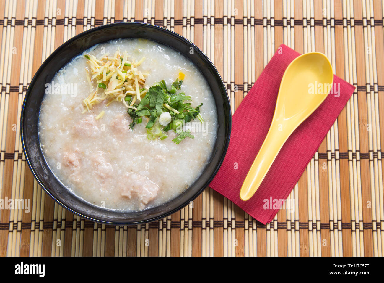 Congee, Rice porridge, Rice gruel, Rice soup on wooden background, Top ...
