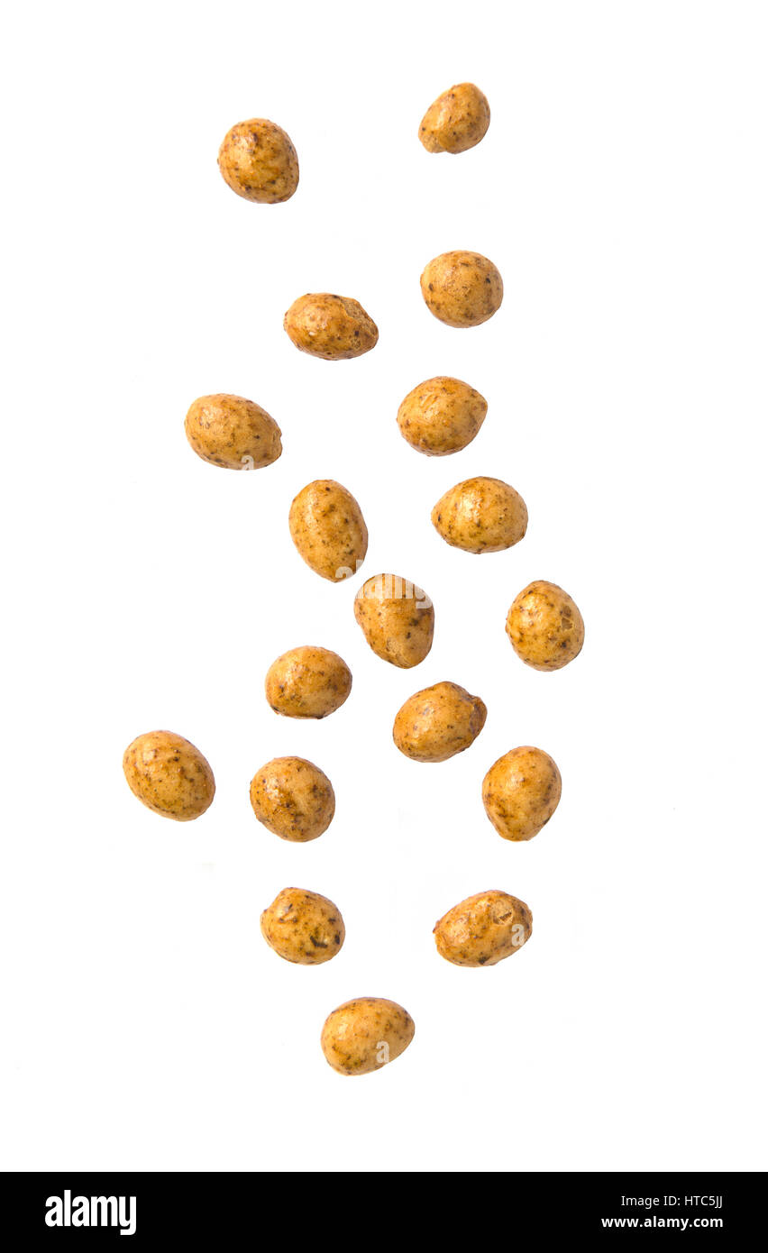 Roasted peanuts coated falling on white background Stock Photo - Alamy