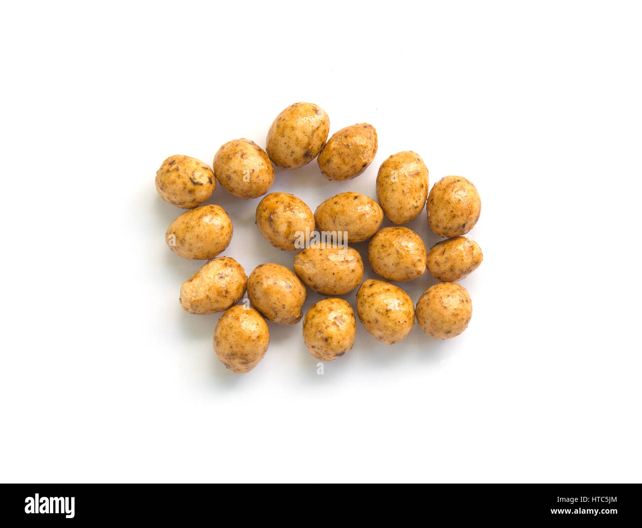 Roasted peanuts coated isolated on white background Stock Photo - Alamy