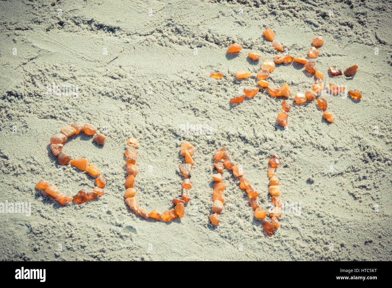 Vintage photo, Inscription sun and shape of sun made of amber stones on ...