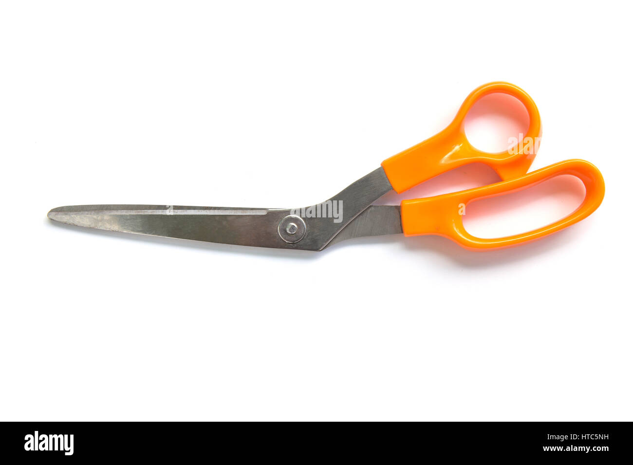 Orange scissors isolated on a white background Stock Photo - Alamy