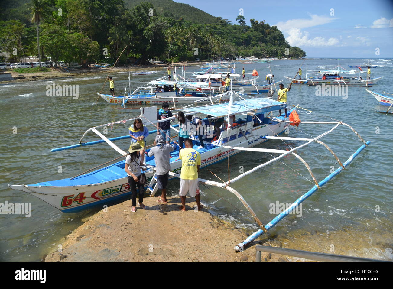 Traditional fishing boat used for tourist transportation, outrigger, at ...
