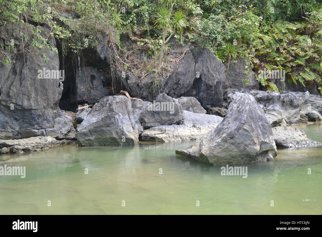 Philippines, Palawan, Sabang beach at Underground River. River is ...