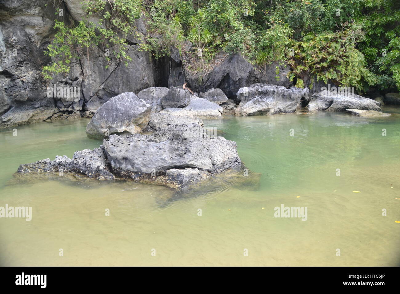Philippines, Palawan, Sabang beach at Underground River. River is ...