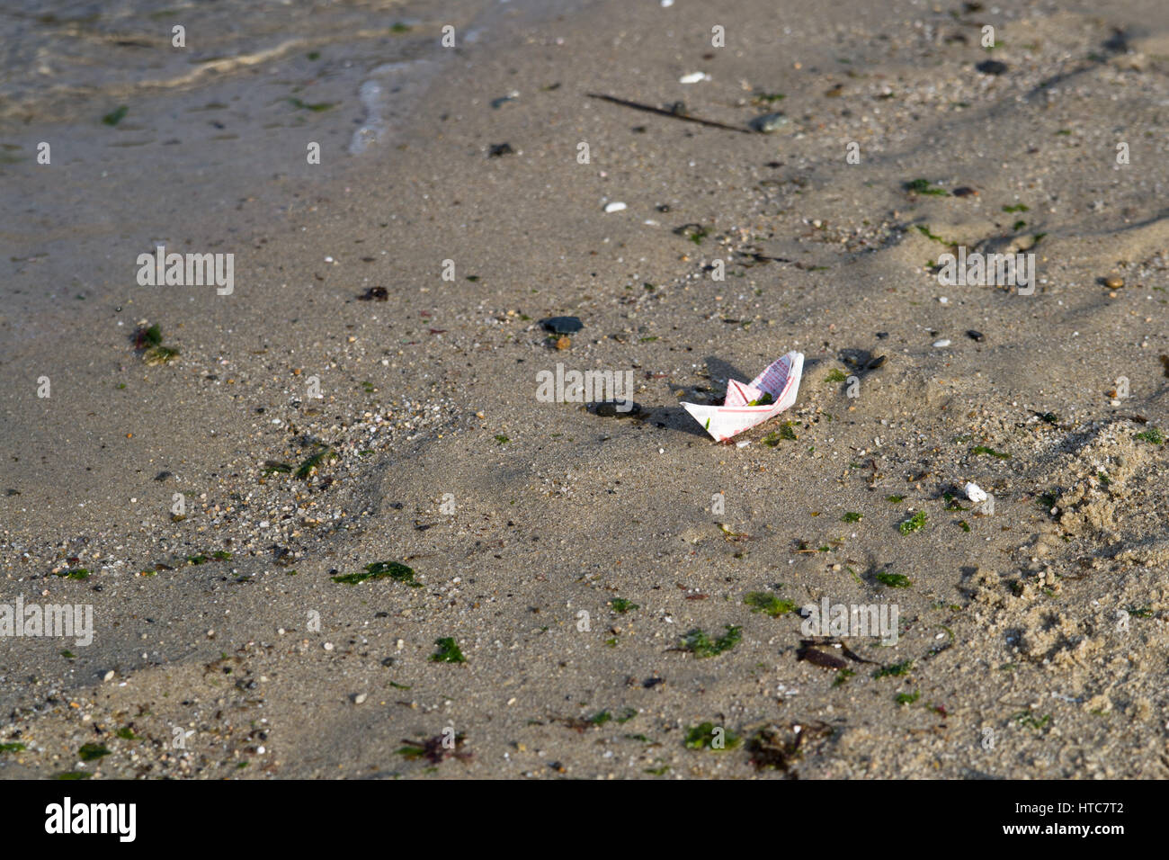 Paper boat on sand hi-res stock photography and images - Alamy