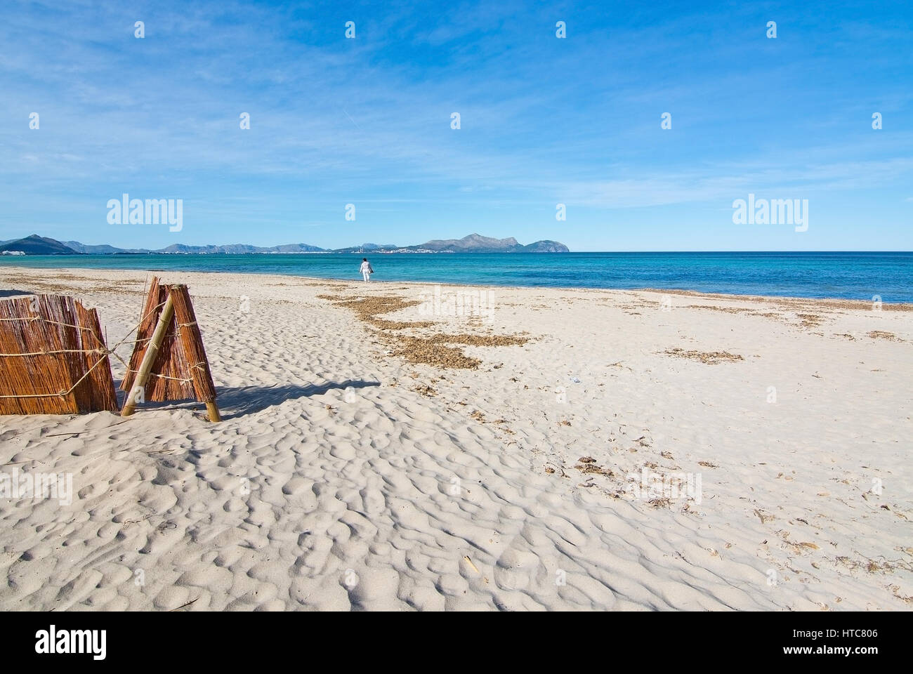 Empty sandy Mediterranean beach in spring sunshine in Majorca, Spain ...