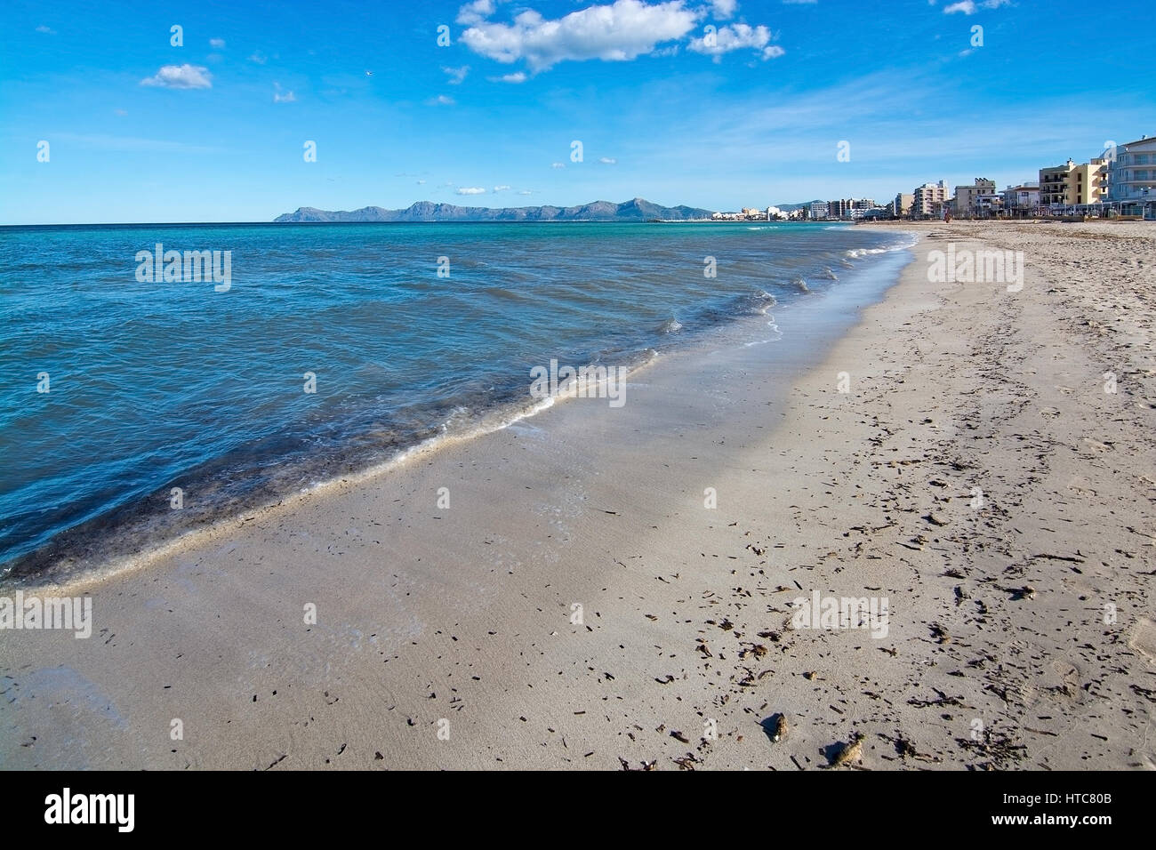 Empty sandy Mediterranean beach in spring sunshine in Majorca, Spain ...
