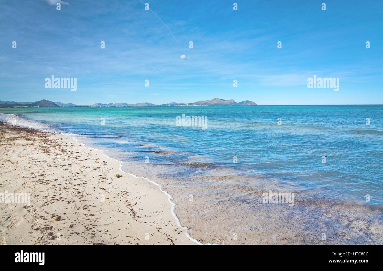 Empty sandy Mediterranean beach in spring sunshine in Majorca, Spain ...