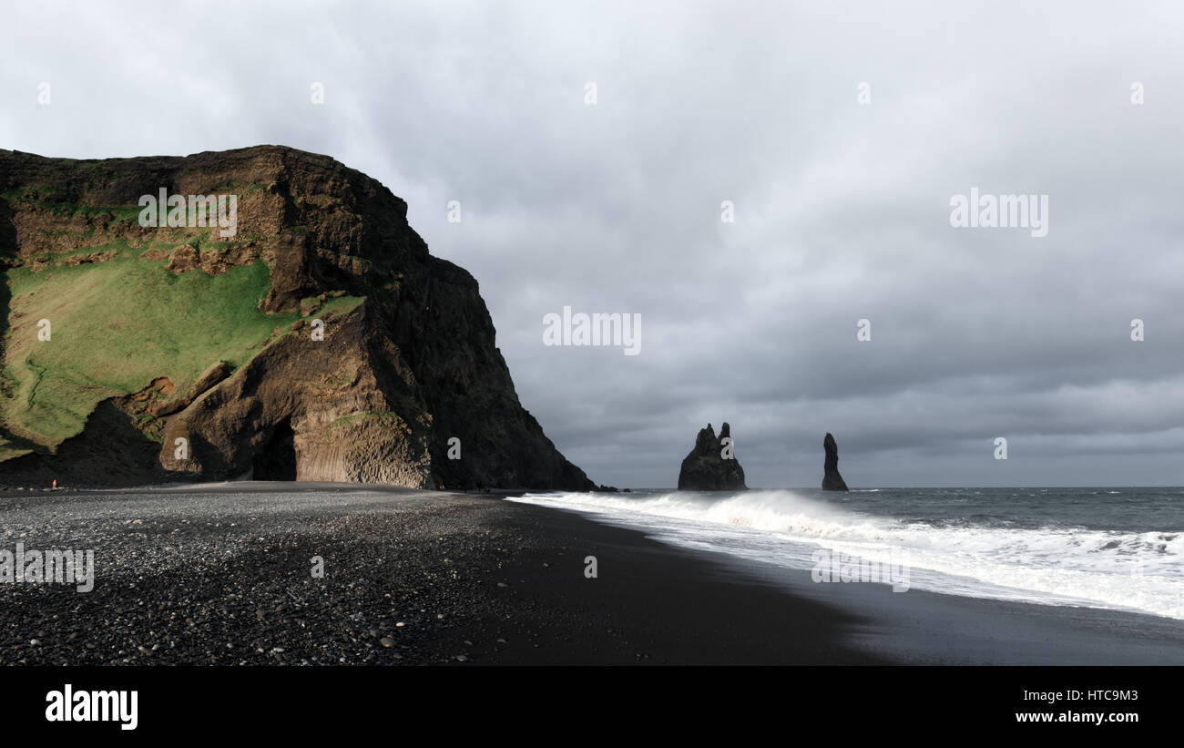Basalt rock formations "Troll toes" on black beach. Reynisdrangar, Vik ...