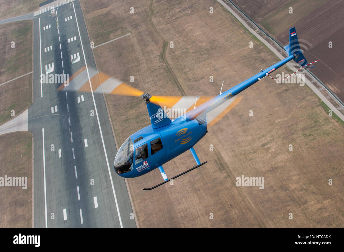 Robinson R44 light helicopter operated by Balkan Helicopters in flight ...