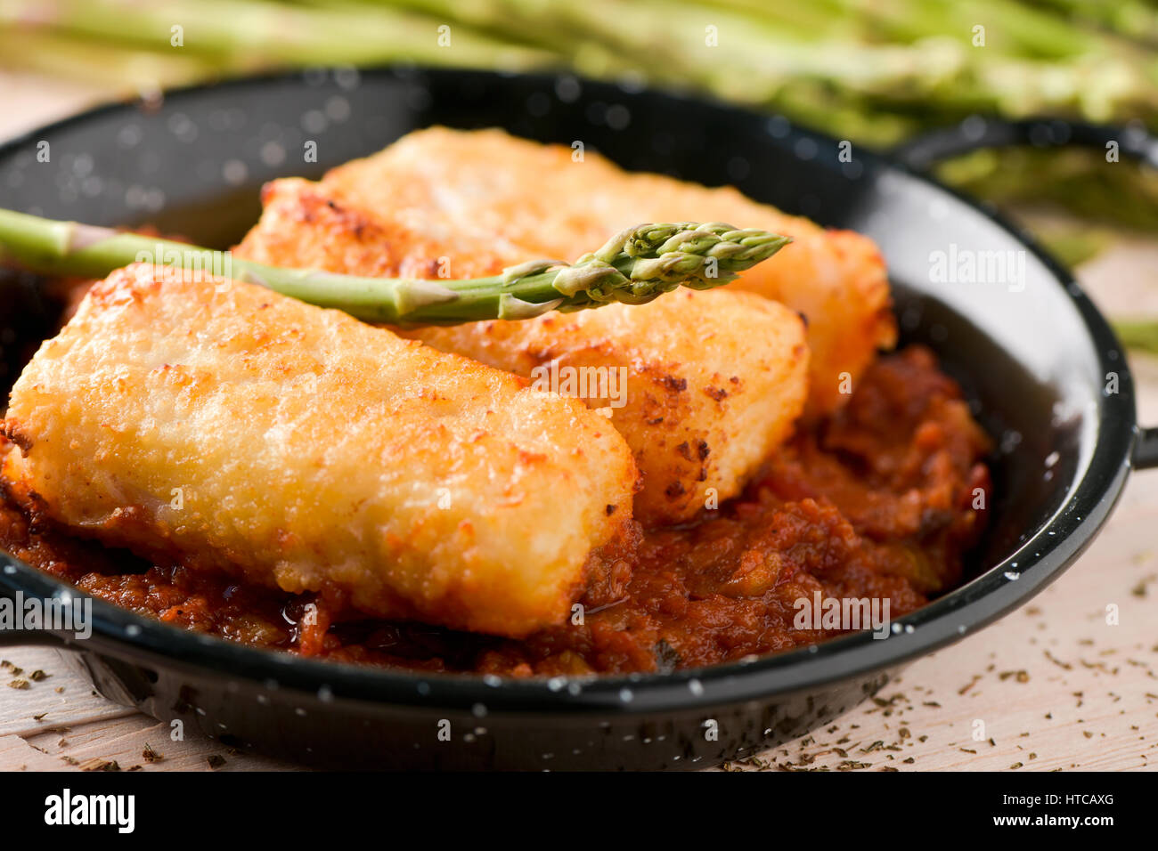 closeup of a frying pan with bacalao a la vizcaina, a typical spanish ...