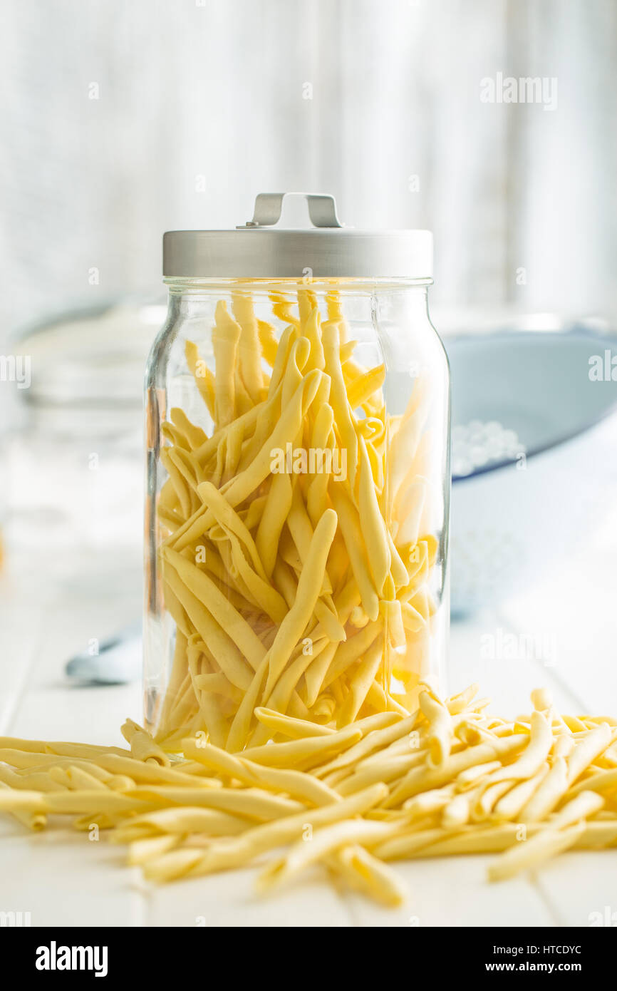 Raw italian pasta in jar Stock Photo - Alamy